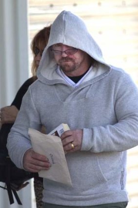 Former bikie jailed for torching police car