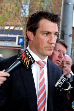 Swimmer Cowley denies he was about to hit man who bashed him