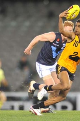 Fremantle's Michael Walters helps Josh Simpson