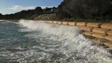 Portsea retains sandbag wall against expert advice