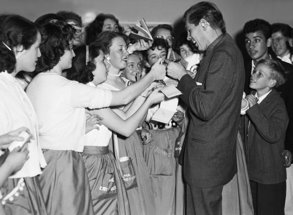 From the Archives, 1957: Police escort Johnnie Ray from stadium