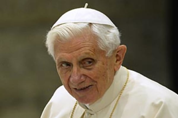 Italian priest burns photo of former pope