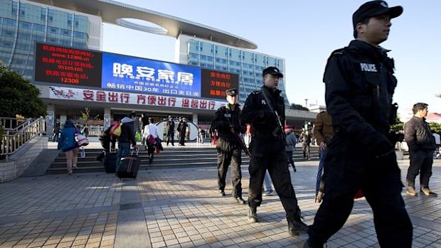 Armed police fill Beijing streets in Kunming massacre response