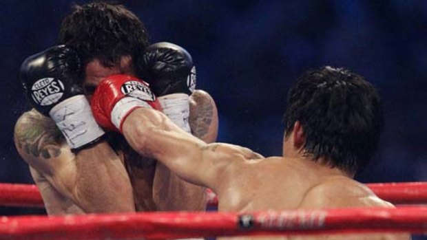 Pacquiao's trainer calls out Mayweather