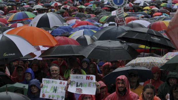 Crowd braves rain for climate change rally