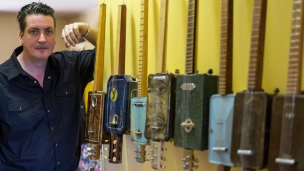Guitar maker Jon Free finds metal edge in cigar-box trade