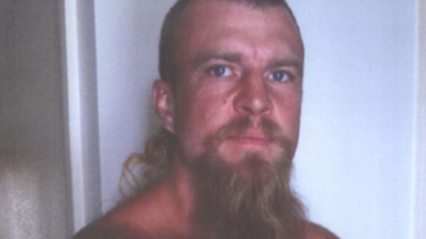 Wanted man 'has two firearms': police search bushland for Rowley