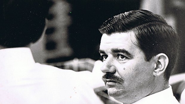 A man at home behind a typewriter