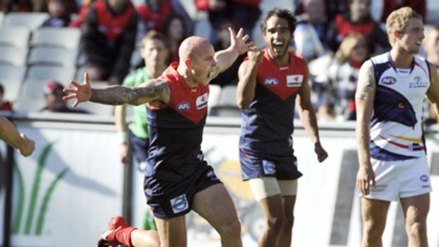 Demons open account, defeating injury-hit Crows
