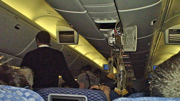 Plane forced down as turbulence injures 26