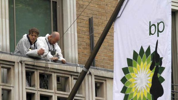 Greenpeace activists scale BP London building