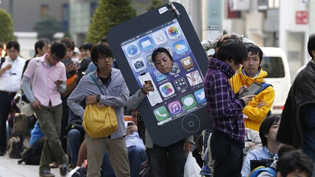 Why do the Apple fans queue for iPhones?