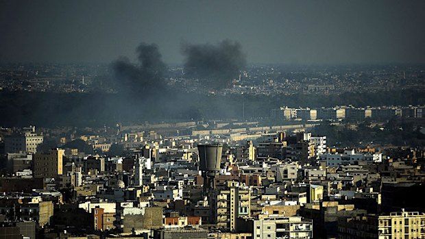 Gaddafi sons free as rebels and loyalists fight for Tripoli