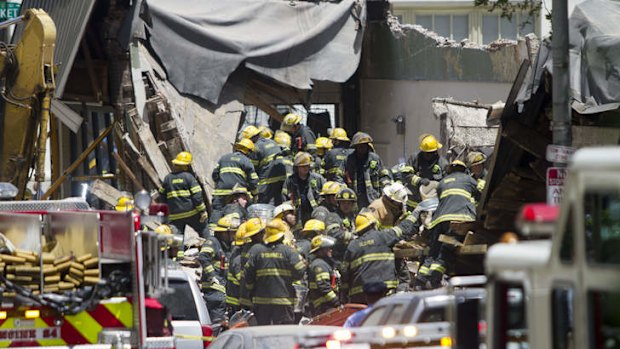 One dead, 13 hurt in US building collapse