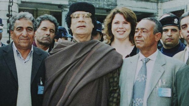 Gaddafi's 'voluptuous blonde' nurse flees Libya