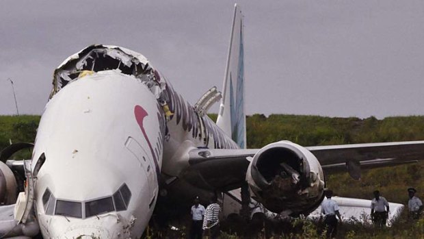Plane splits in two after landing
