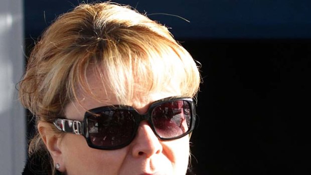 Gaddafi's 'voluptuous blonde' nurse flees Libya