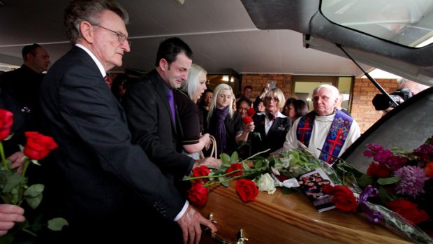 Joan Ryther's husband pays tribute at Woodridge funeral