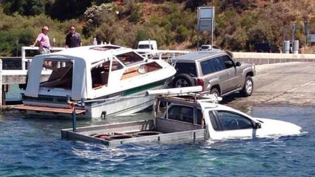 Jetskier's ute rolls into ocean