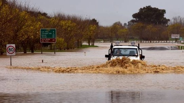 More towns under threat as record rain moves downstream