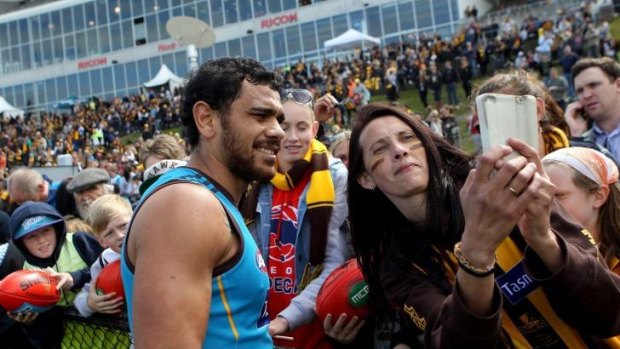 Pilgrims flock to brown and gold temple in a regular Hawthorn ritual