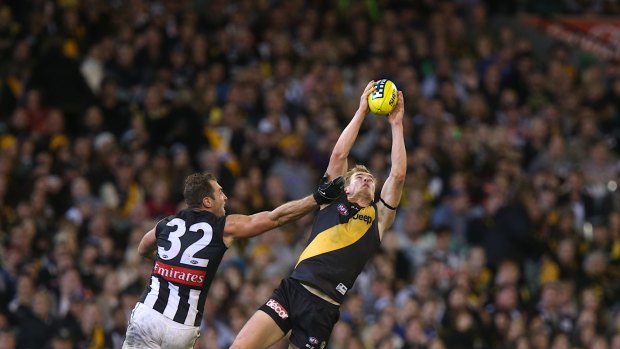 Richmond Tigers re-sign David Astbury and Oleg Markov