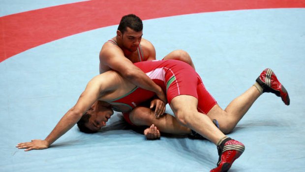 Wrestling back for Tokyo Games after IOC vote win
