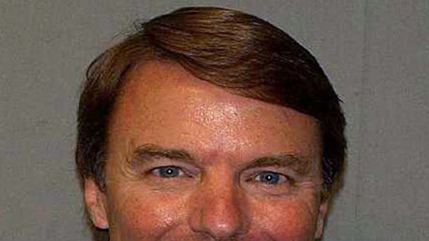 Indicted John Edwards smiles in police mug shot