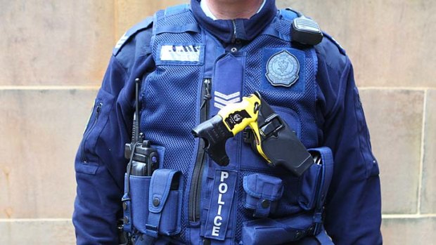 Police look at video cameras on uniforms