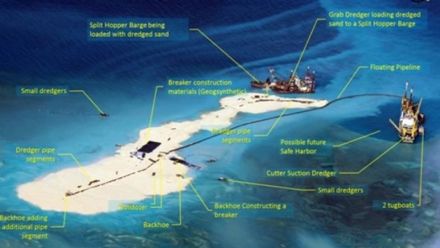 Photos reveal China building on reefs in disputed waters