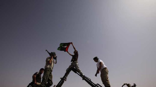 Gaddafi security chief flees country