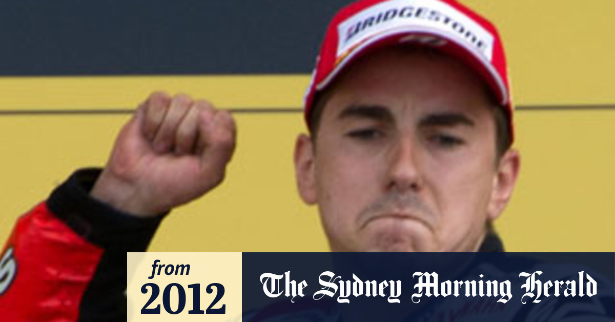 Lorenzo beats Stoner in epic at Silverstone