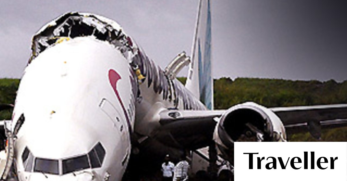 Plane splits in two after landing