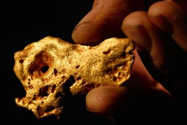 Gold shines as world woes mount