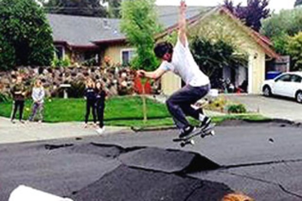 California earthquake: skateboaders show their skills on buckled asphalt