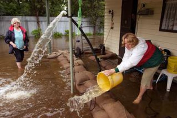 Flood-soaked towns brace for more rain