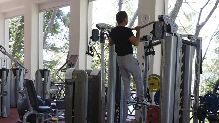 New photos show Vladimir Putin flexing his muscles as Russia dips into ...