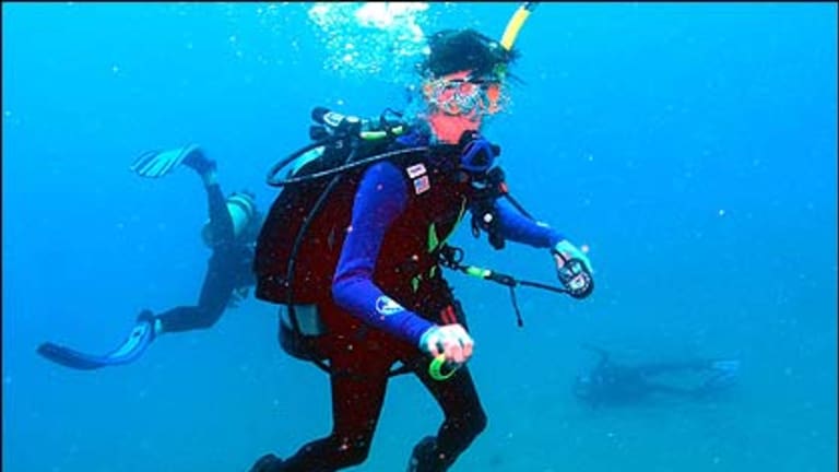 Great Barrier Reef death: scuba diver admits letting wife drown