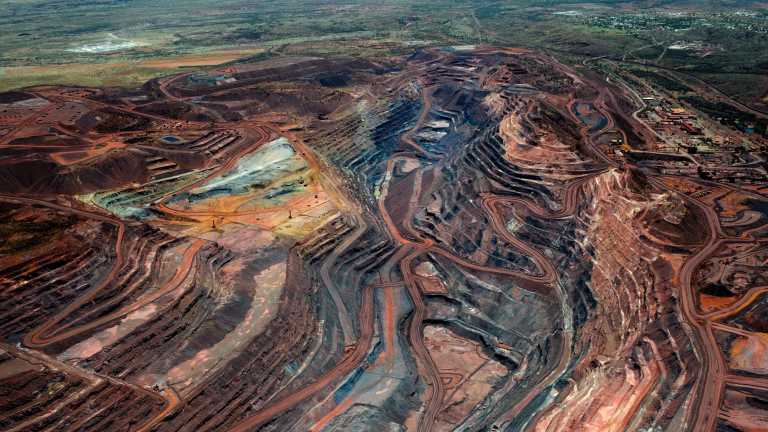 BHP says iron ore output hurt by WA mine fire, but sticks with annual ...