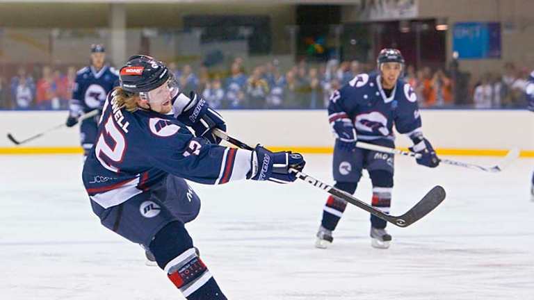 Ice hockey shoots, and scores