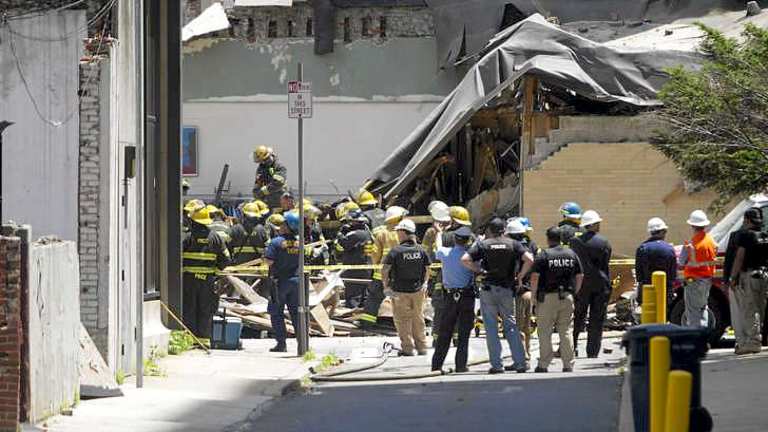 One dead, 13 hurt in US building collapse