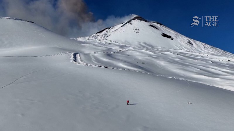 Video: Skier comes down Mount Etna as volcano erupts in the background