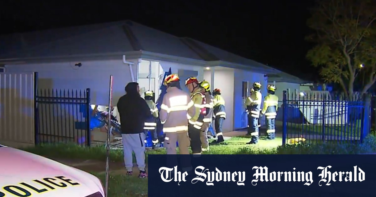 Video: Man sleeping in bed when car crashes through home