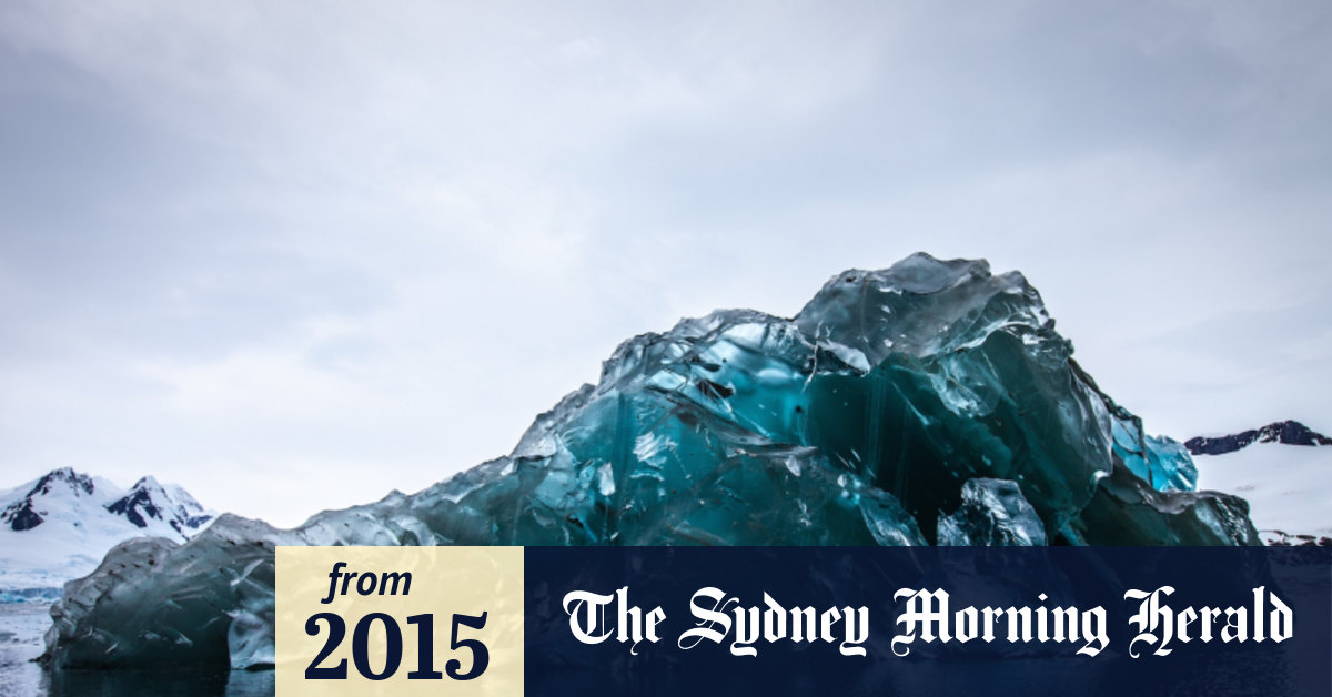Photographer captures rare shot of flipped iceberg's underbelly