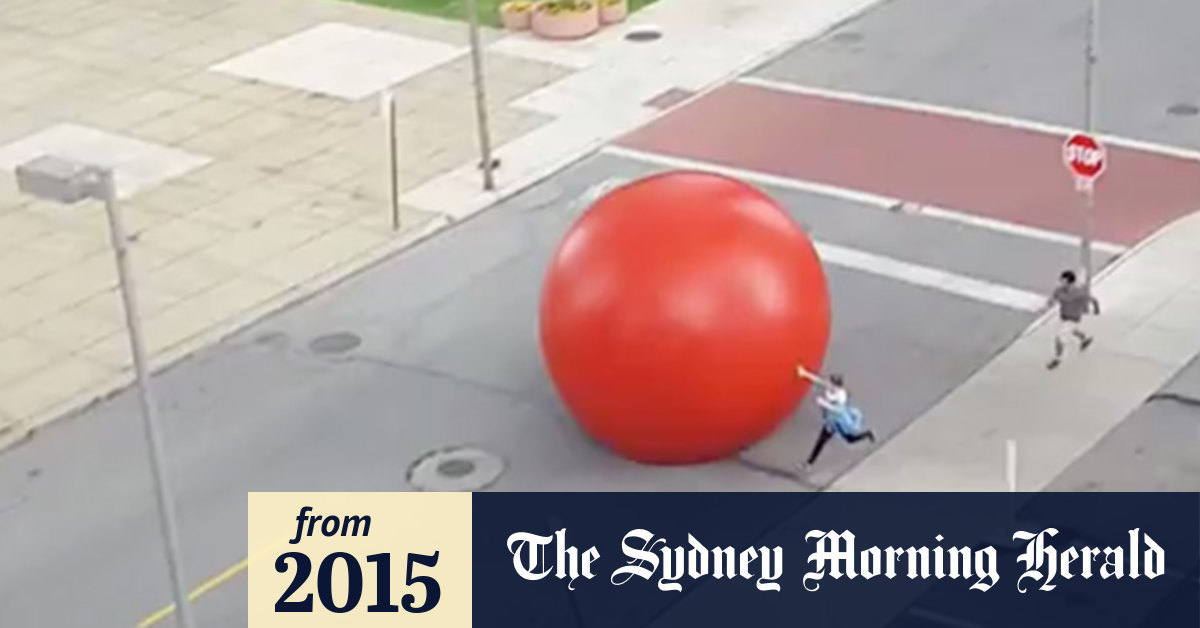 Video: Giant red ball goes rogue, rolls through city