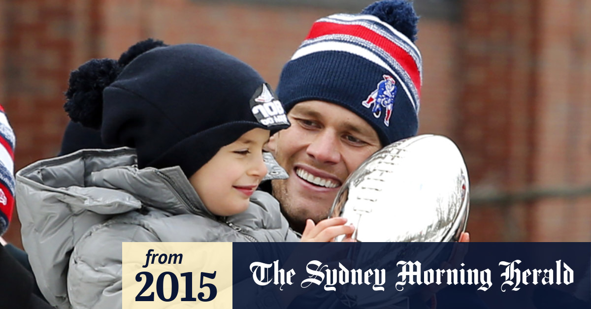 Fans cheer New England Patriots atop Boston snow piles at Super Bowl parade