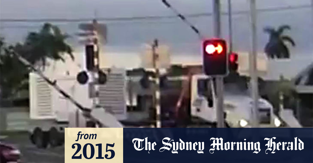 Video: Truck breaks through boom gates