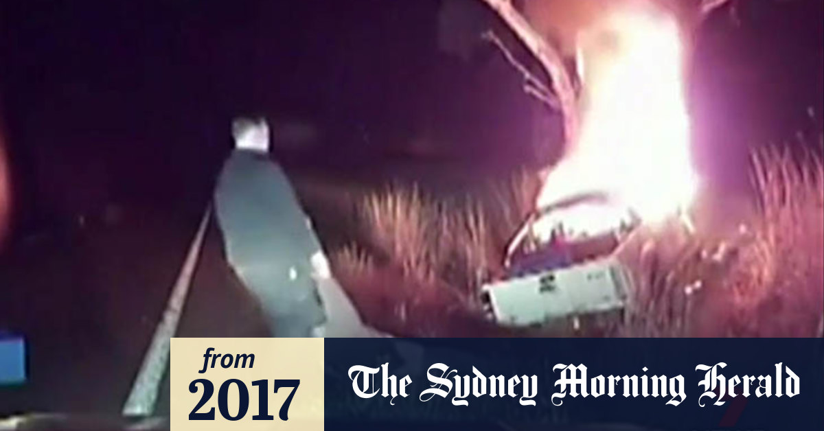 Video: Man saves unconscious driver from burning car