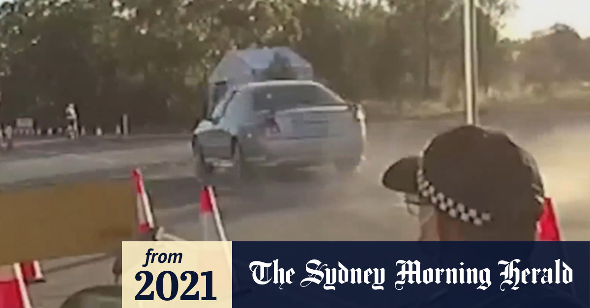 Video: Checkpoint driver narrowly misses almost a dozen workers