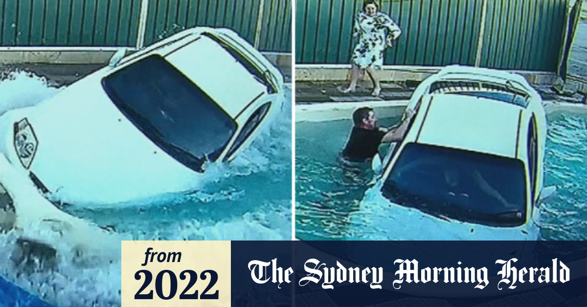 Video: Driver crashes through fence into swimming pool